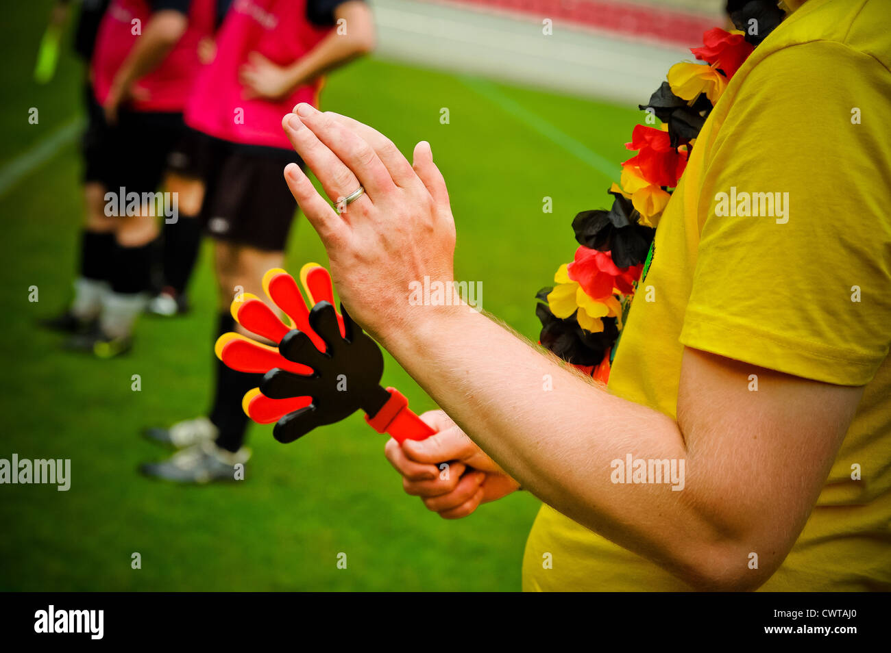 Soccer fan clapping hands at soccer pitch Stock Photo - Alamy