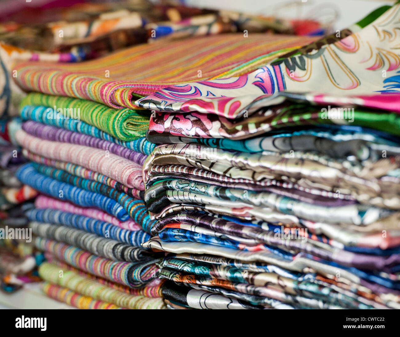 Fabrics and scarves for sale at a market stall Stock Photo - Alamy