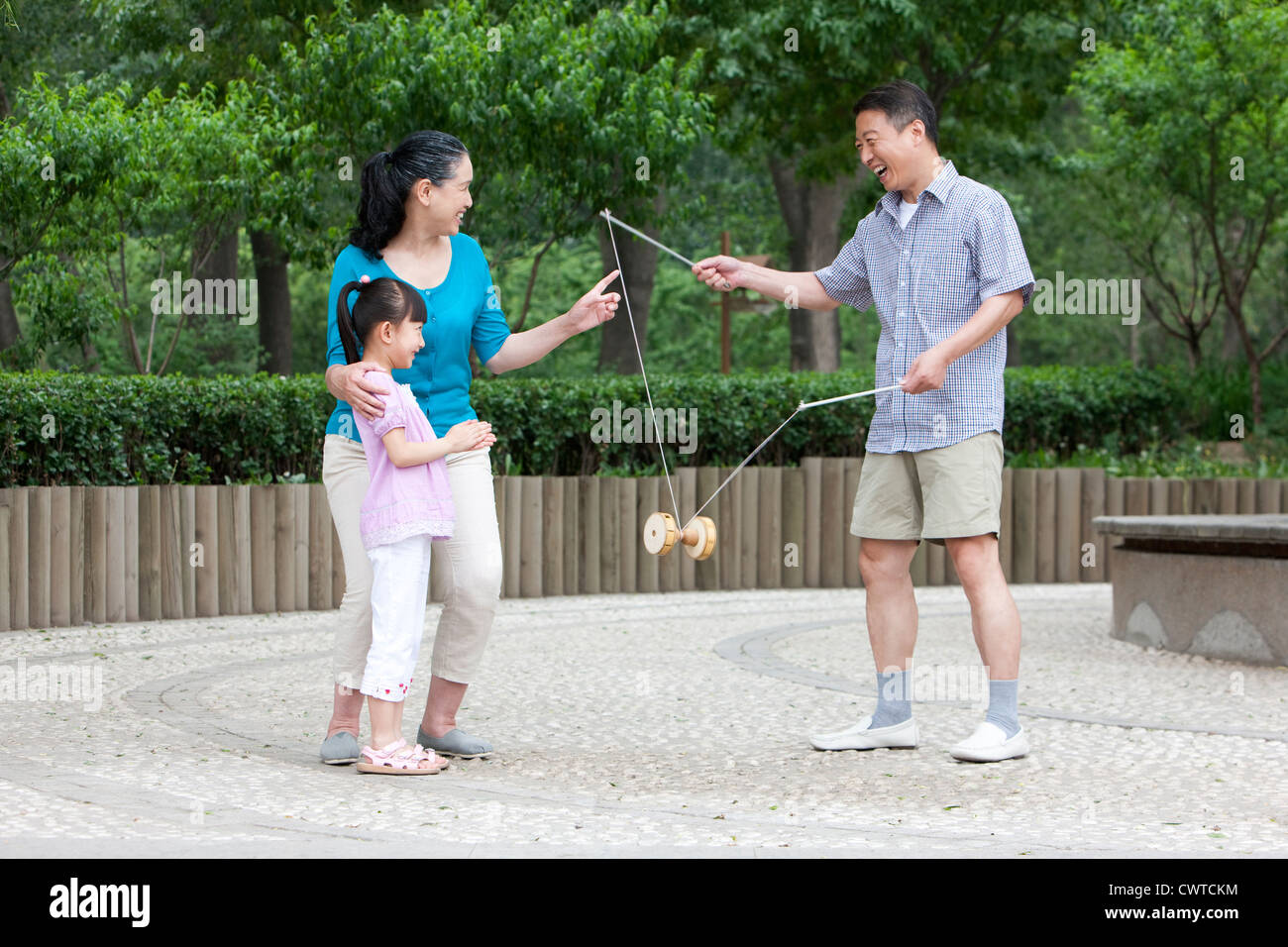 Grandfather playing Chinese traditional diabolo Stock Photo - Alamy