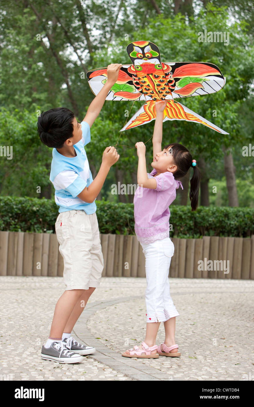 Children flying a kite Stock Photo - Alamy