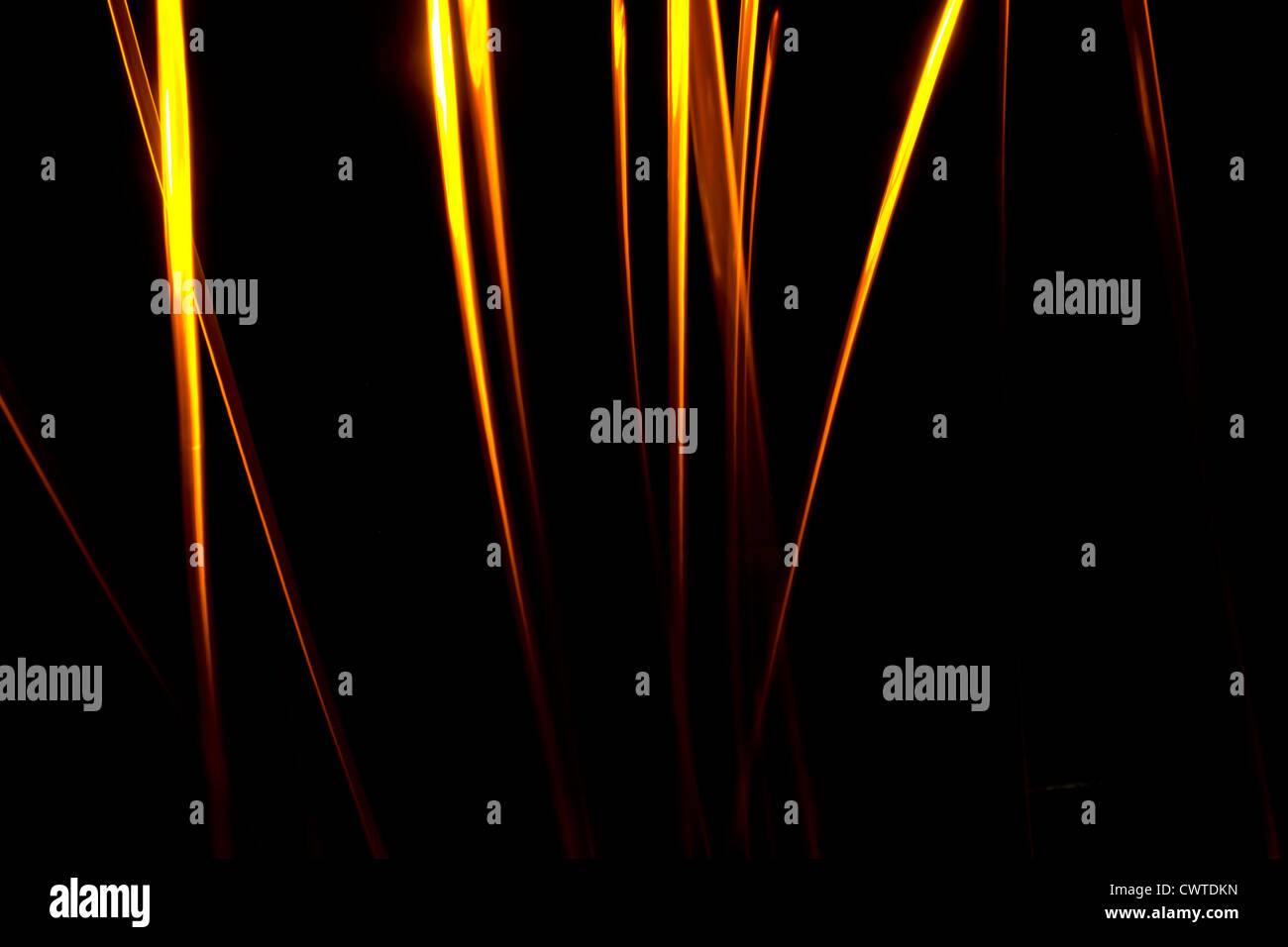 abstract chaos fire rays on dark background Stock Photo - Alamy