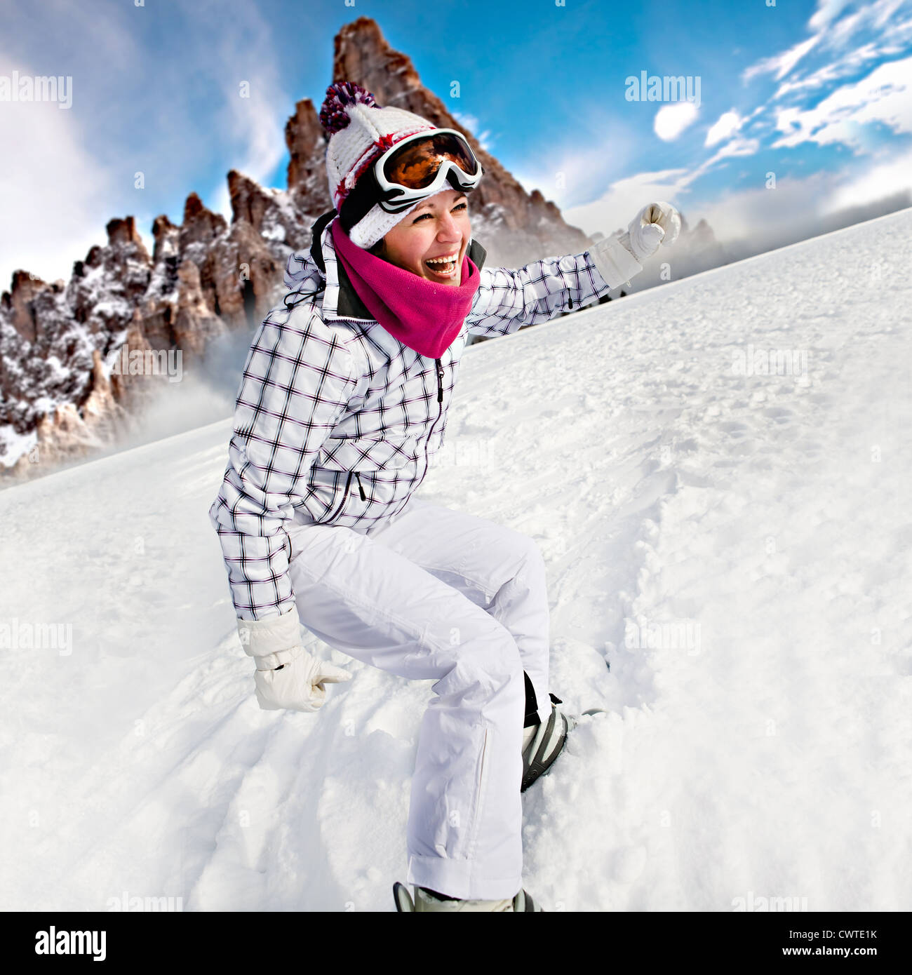 A young woman snowboarding in the Alps, an outdoor shoot Stock Photo ...