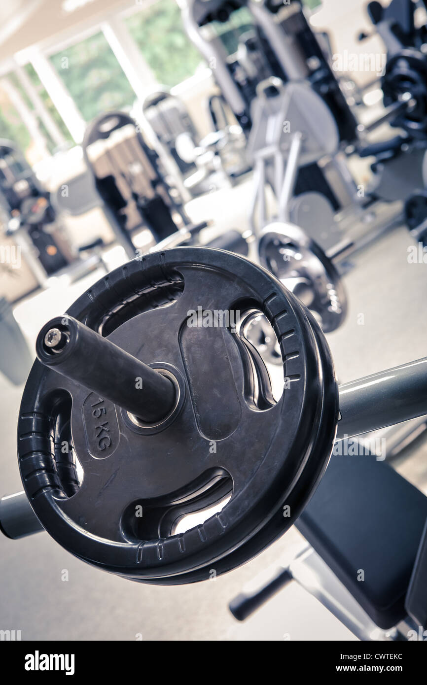 diverse equipment and machines at the gym room Stock Photo - Alamy