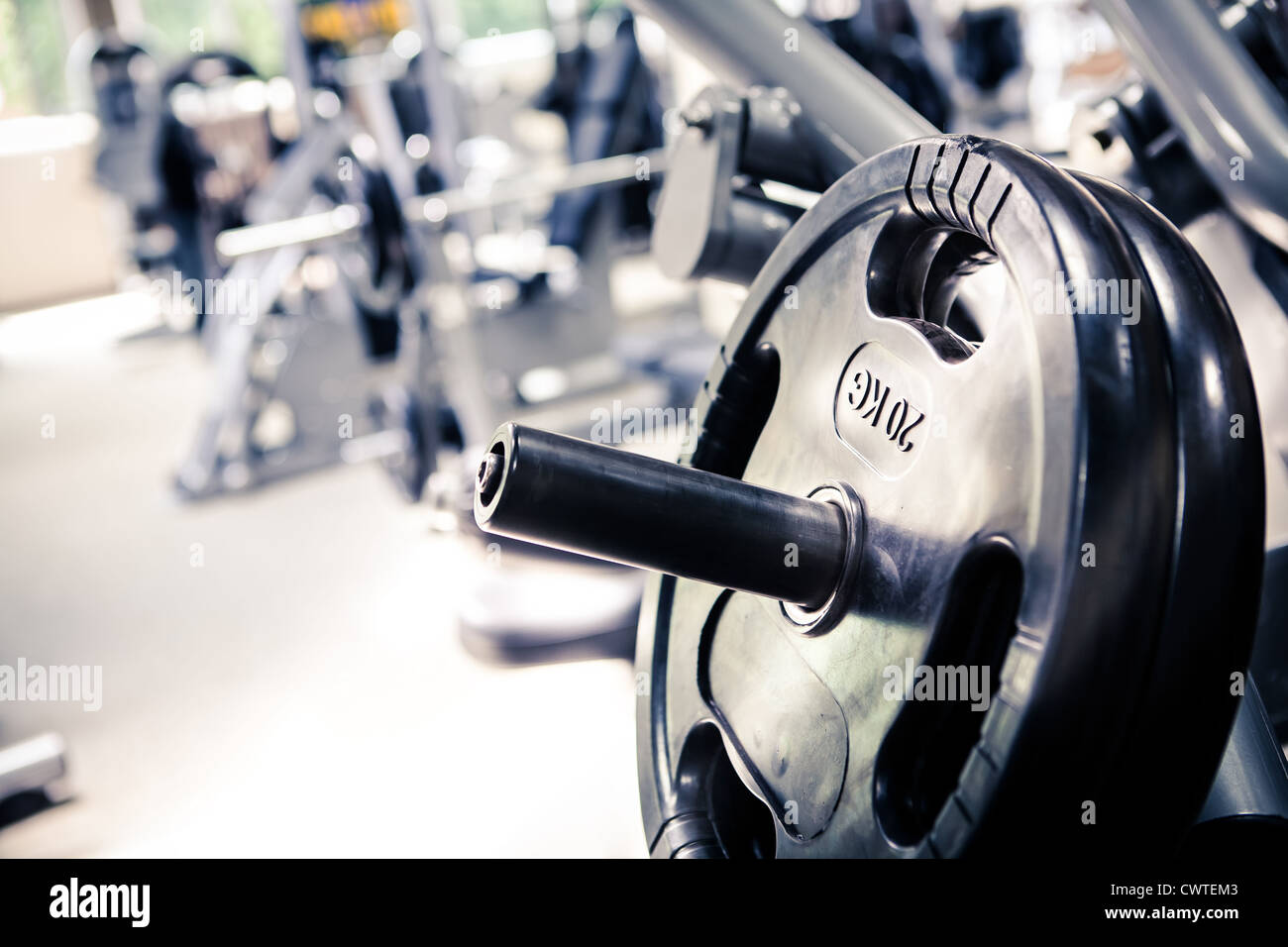 diverse equipment and machines at the gym room Stock Photo - Alamy