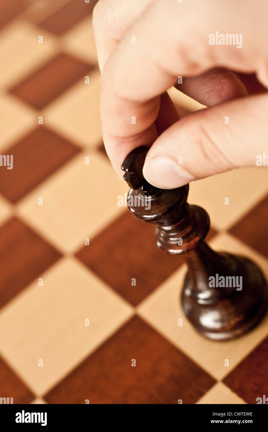 playing a chess king move Stock Photo - Alamy