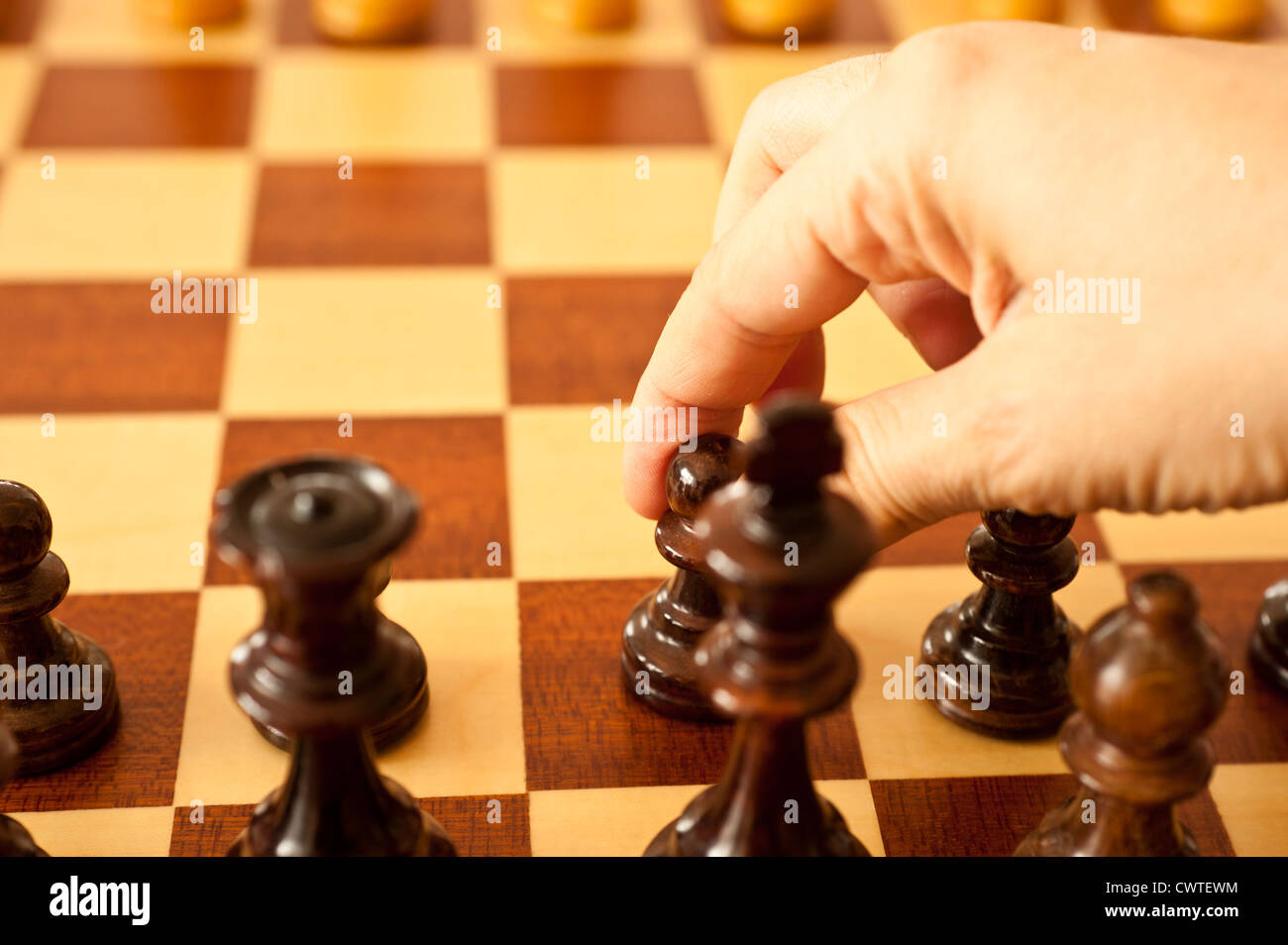 playing a chess pawn move Stock Photo - Alamy