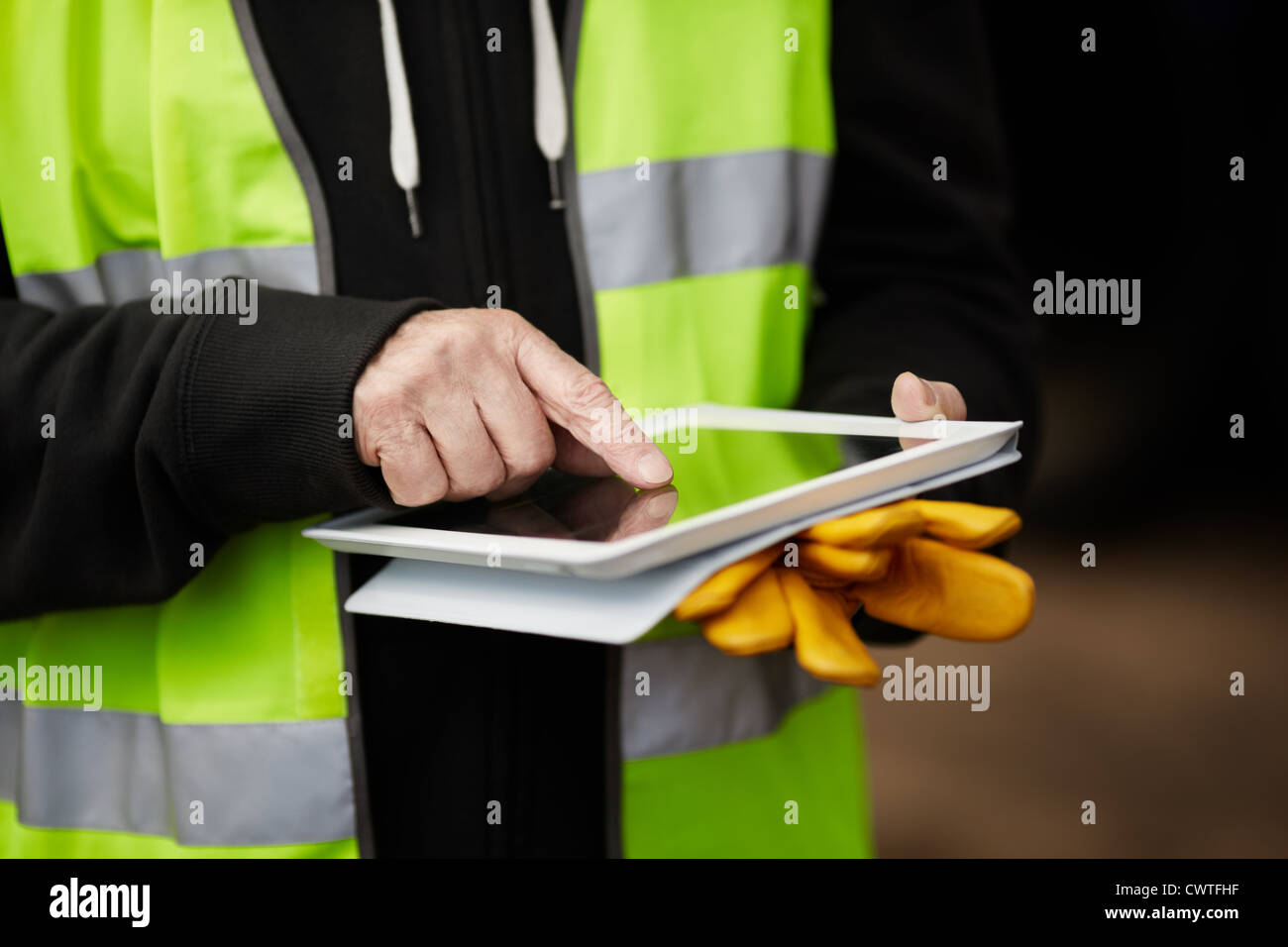 construction worker using digital tablet Stock Photo - Alamy