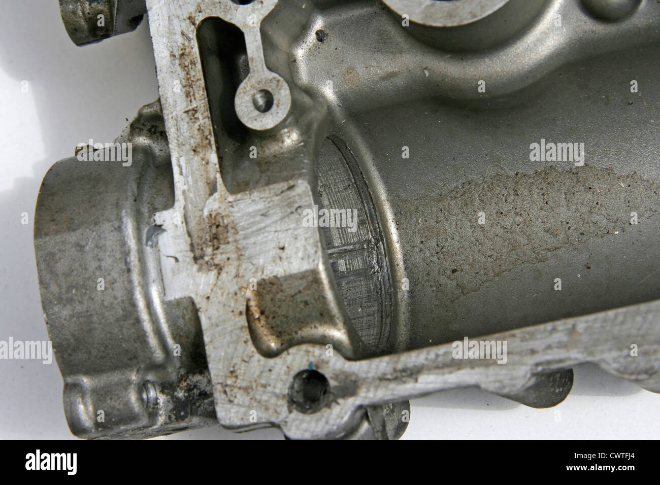 Score marks on an engine camshaft housing due to a blocked oil way ...