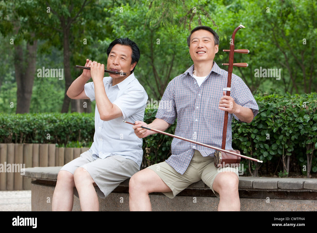 Old men playing Chinese traditional instrument in park Stock Photo - Alamy