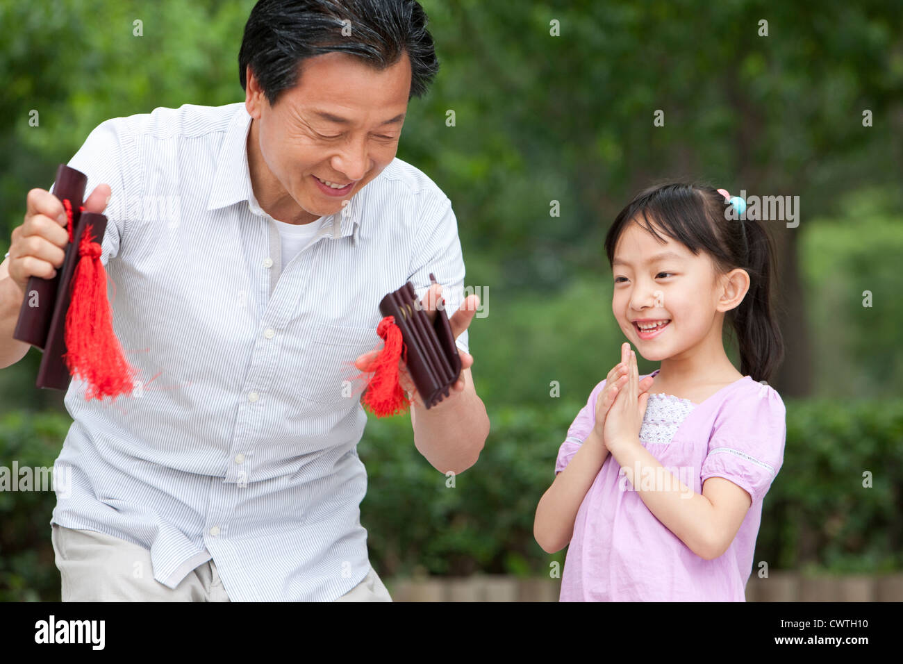 Grandfather playing Chinese traditional musical instrument Kuaiban ...