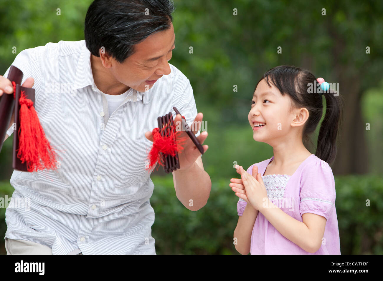 Grandfather playing Chinese traditional musical instrument Kuaiban ...