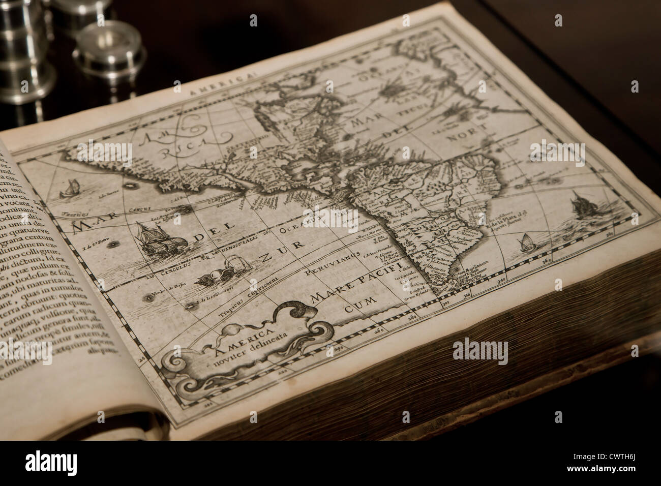 Old book with a distorted map of America Stock Photo - Alamy