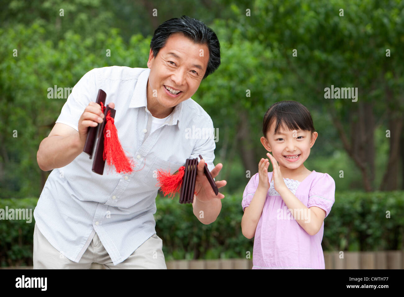 Grandfather playing Chinese traditional musical instrument Kuaiban ...