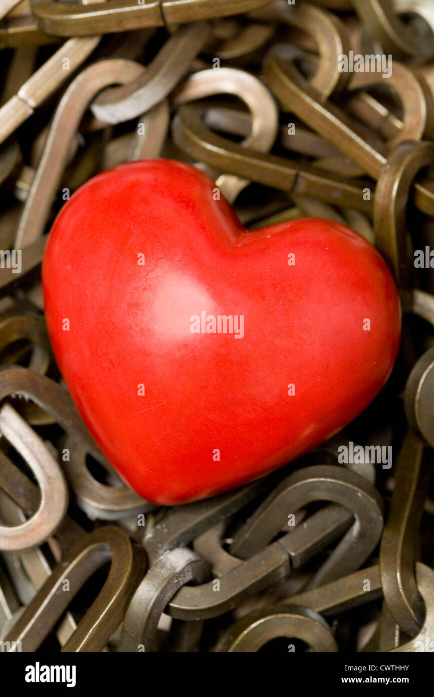 Red heart on a chain Stock Photo - Alamy