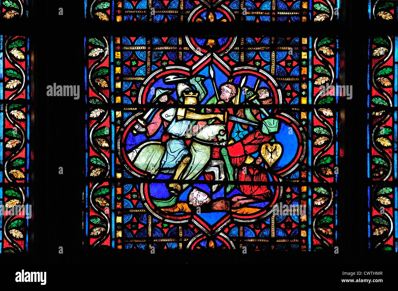 Paris, France. Notre Dame cathedral. Stained glass window. Knight with ...