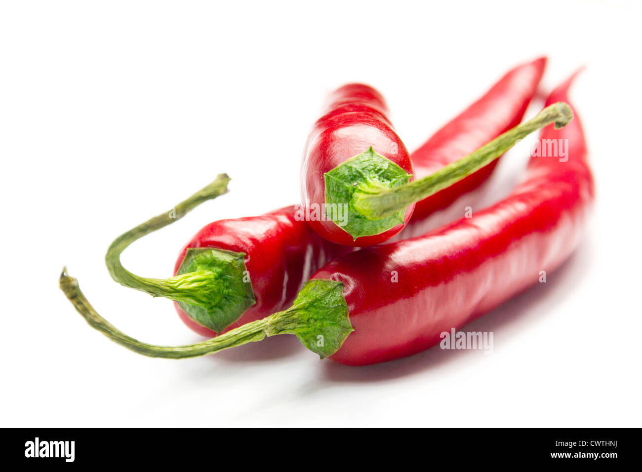 Three red chillies hi-res stock photography and images - Alamy
