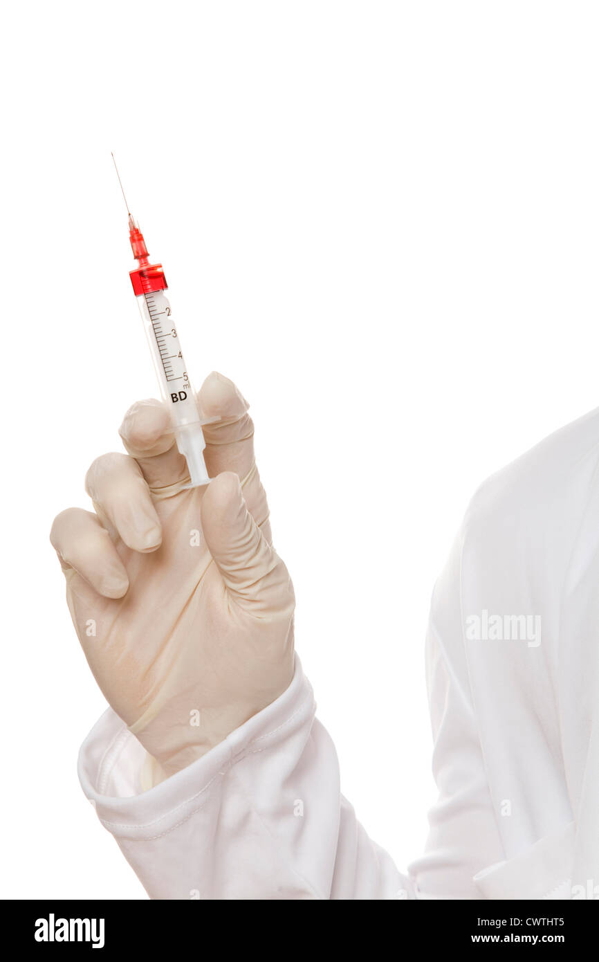 Hand holding syringe Stock Photo - Alamy