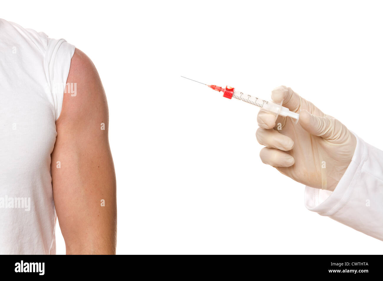 Hand holding syringe next to patient's arm Stock Photo - Alamy
