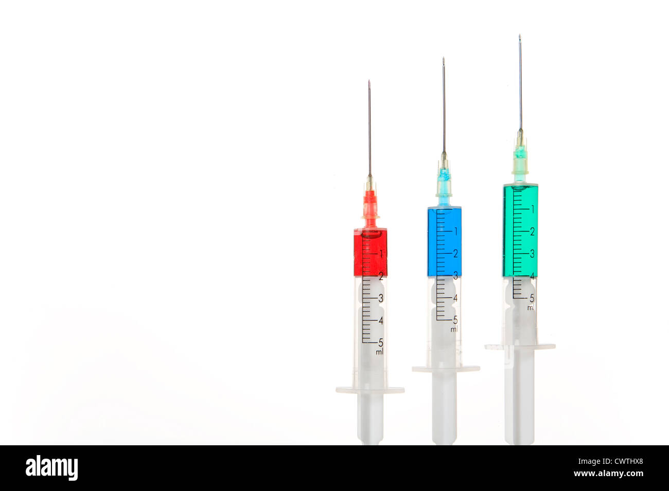 Three syringes with liquid Stock Photo - Alamy