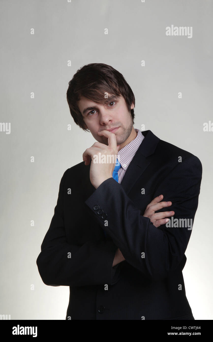 business man thinking looks deep in thought Stock Photo - Alamy