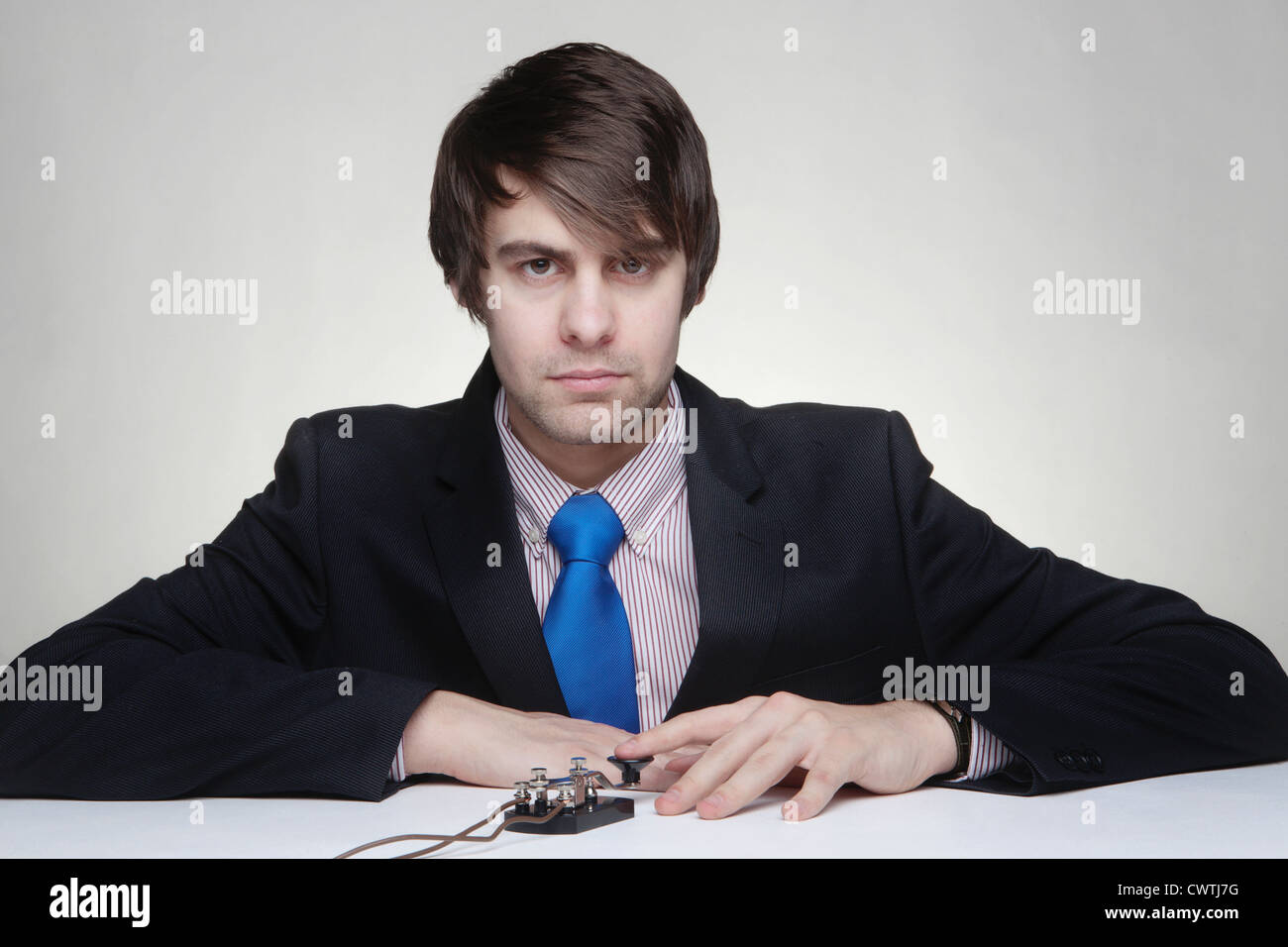 businessman using a morse code key to communicate with someone Stock ...