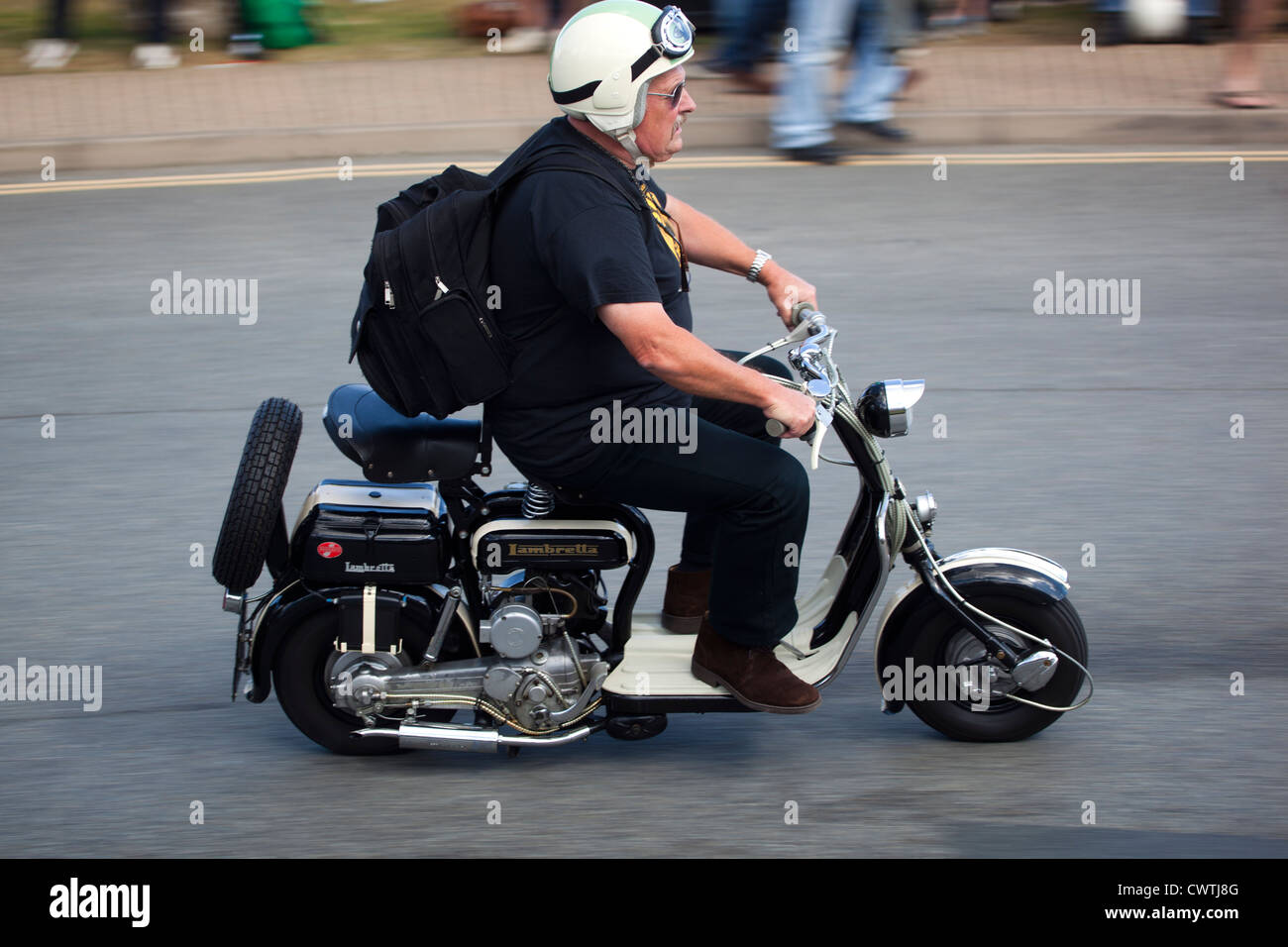 Man in Black riding Customised Scooter Stock Photo - Alamy