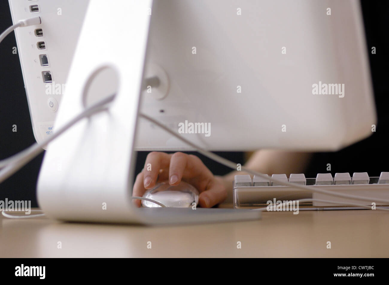 Woman's hand using computer mouse Stock Photo - Alamy