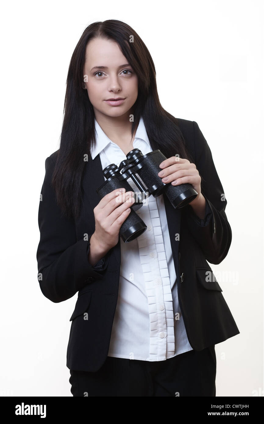 good looking woman holding binoculars up to her eyes wearing a business ...