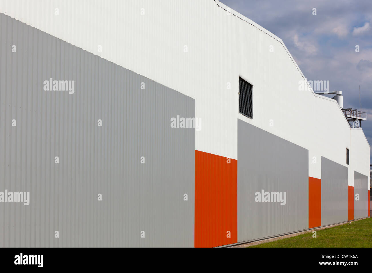 Brightly colored industrial warehouse exterior wall. Horizontal shot ...
