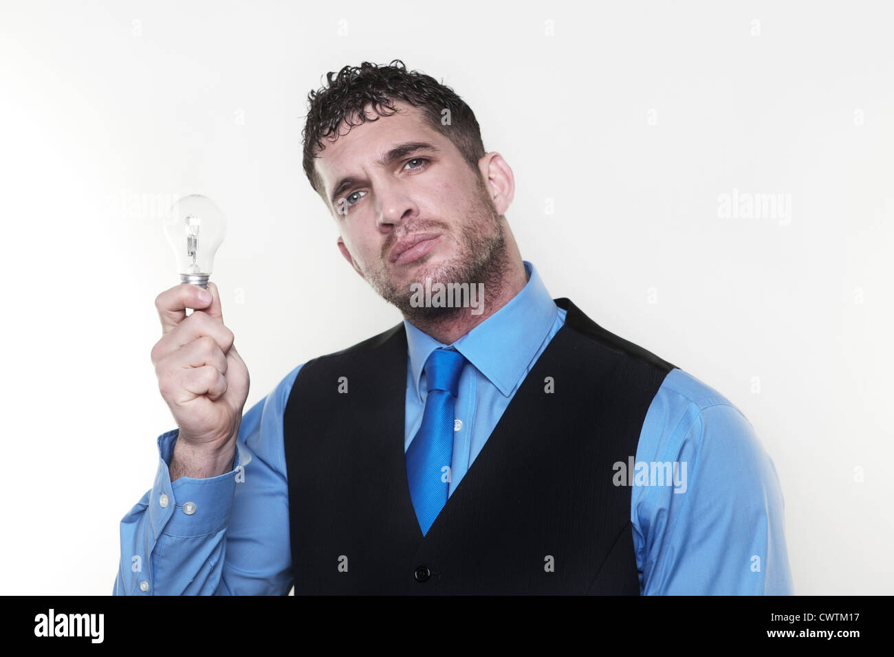 handsome man holding a light bulb in his hand Stock Photo - Alamy