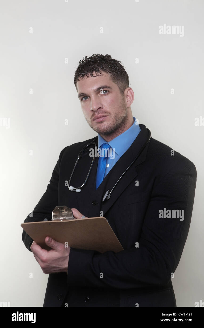 good looking doctor standing looking at camera Stock Photo - Alamy