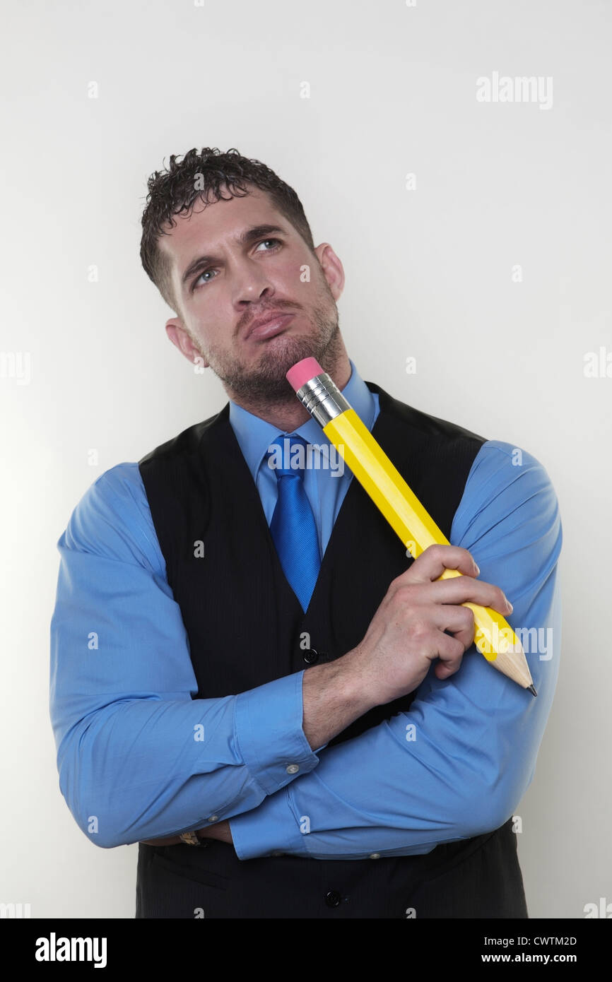 business man with a very large pencil looking a bit silly Stock Photo ...