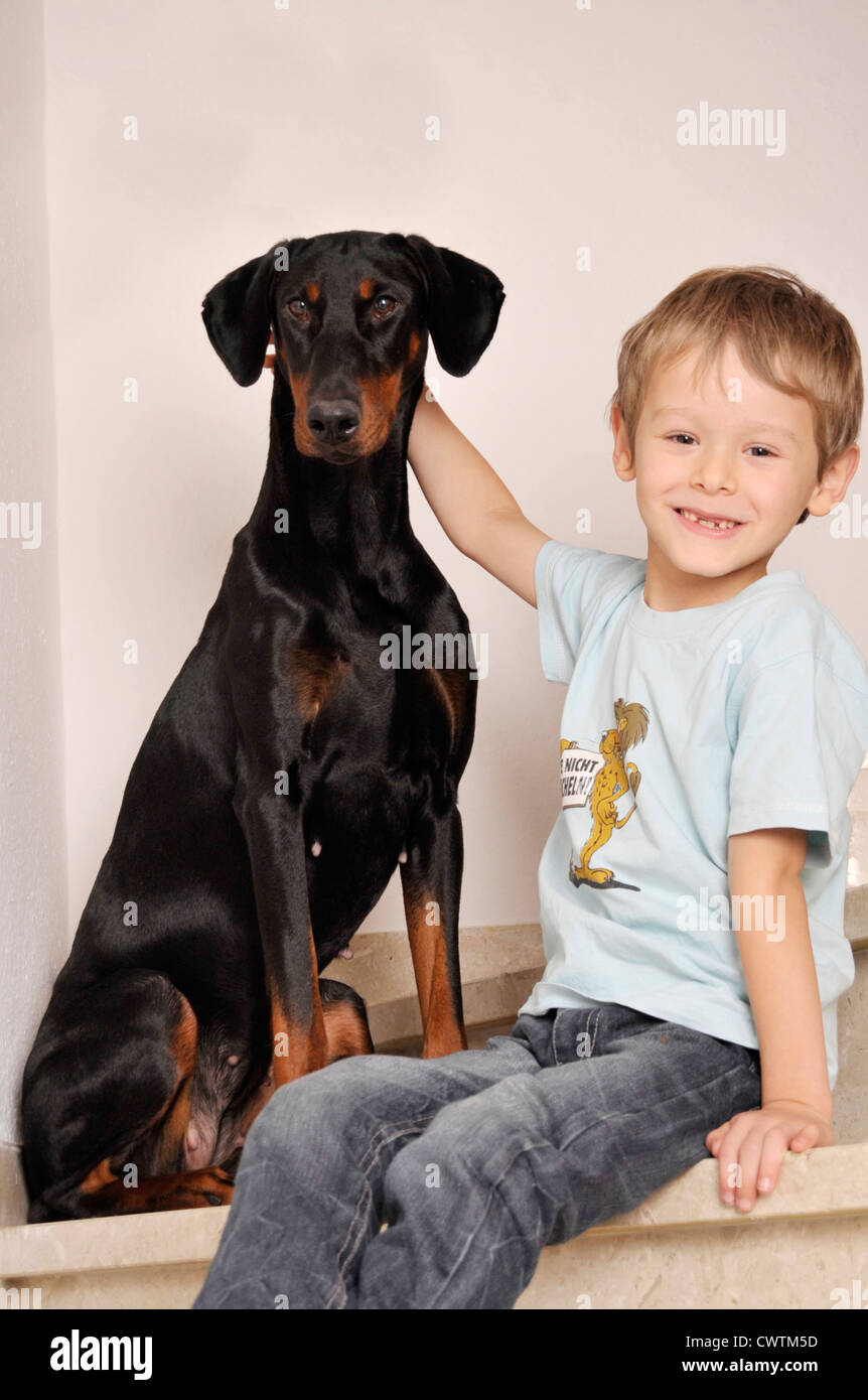 boy with Doberman Pinscher Stock Photo - Alamy