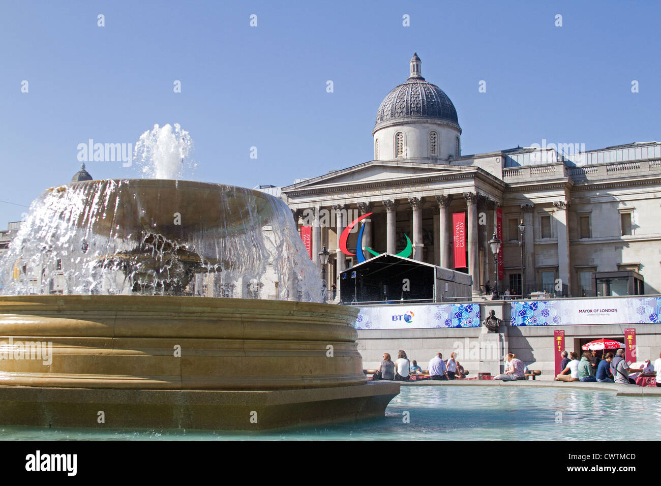 The Water fountains in Trafalgar Square London with the National ...