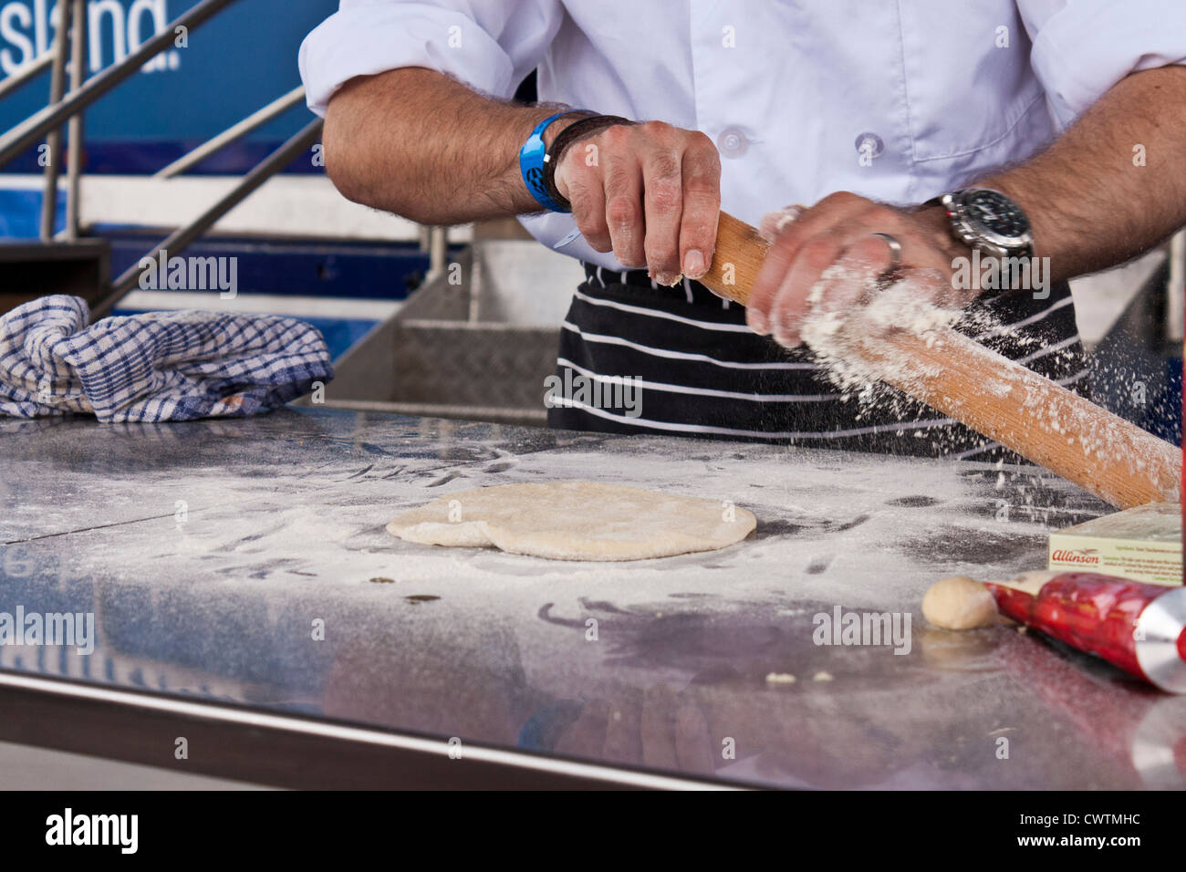 A chef from Co-operative Food wipes excess dough from his rolling pin ...