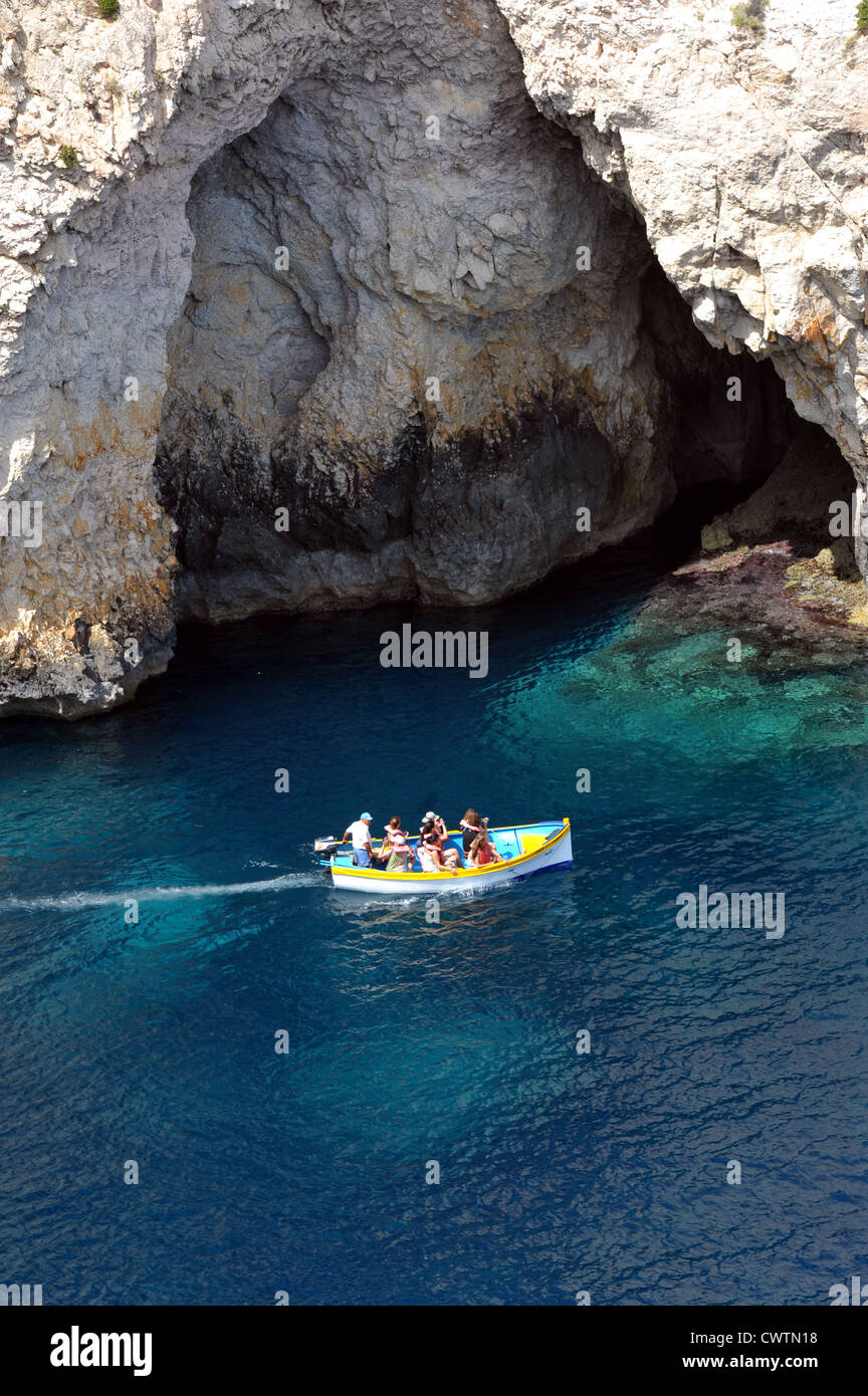 Tourist boat in the Blue Grotto sea caves in Malta Stock Photo - Alamy