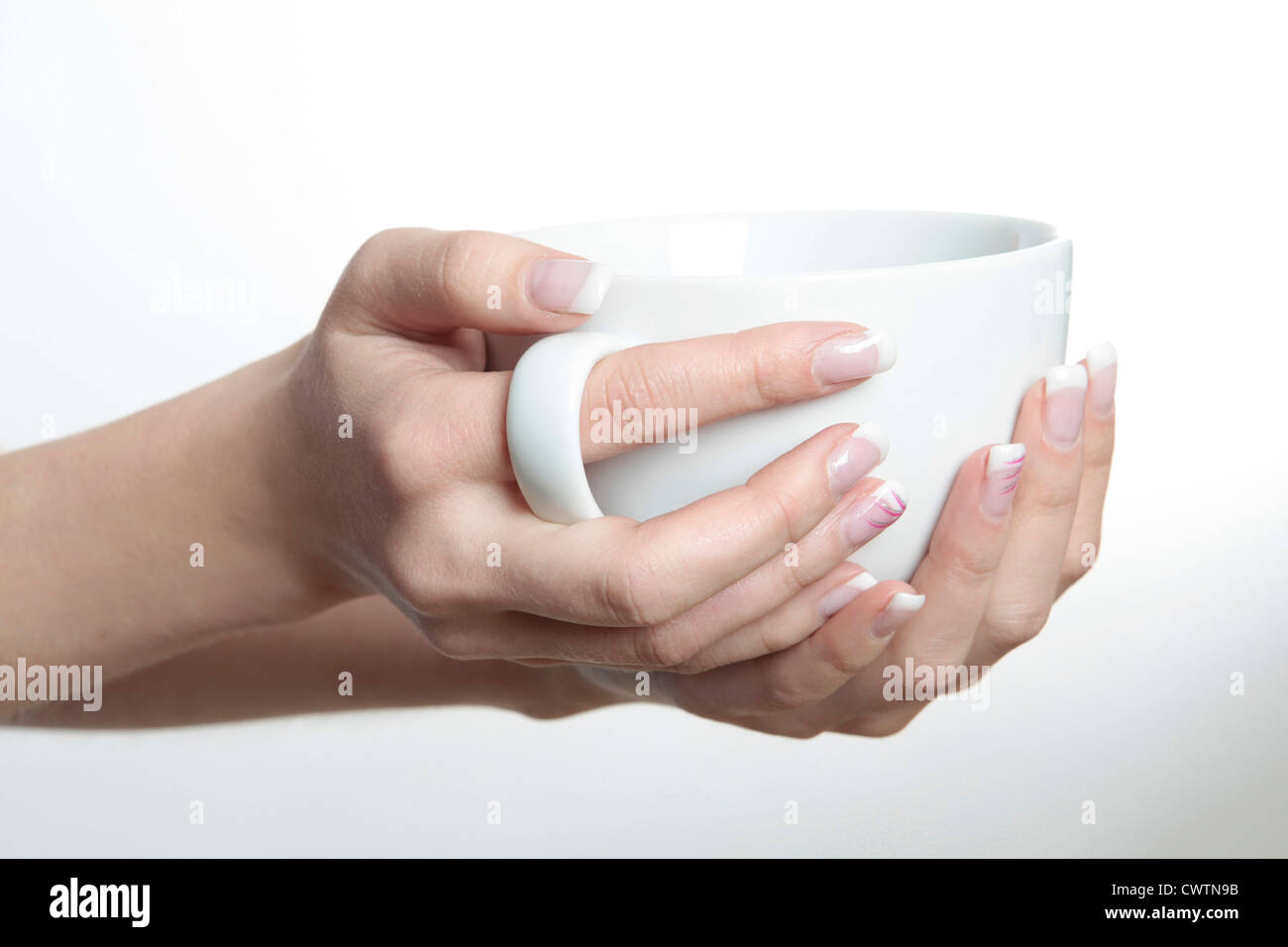Woman's hands holding cup Stock Photo - Alamy
