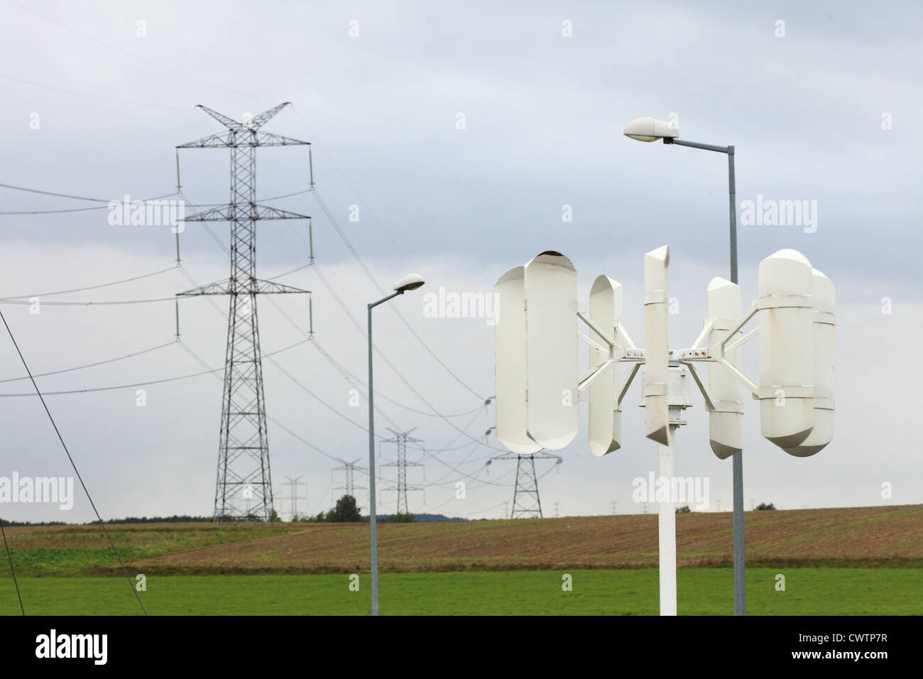windmills for electric power production and electrical Stock Photo - Alamy