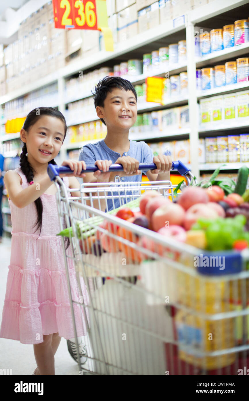 Children shopping in supermarket Stock Photo - Alamy