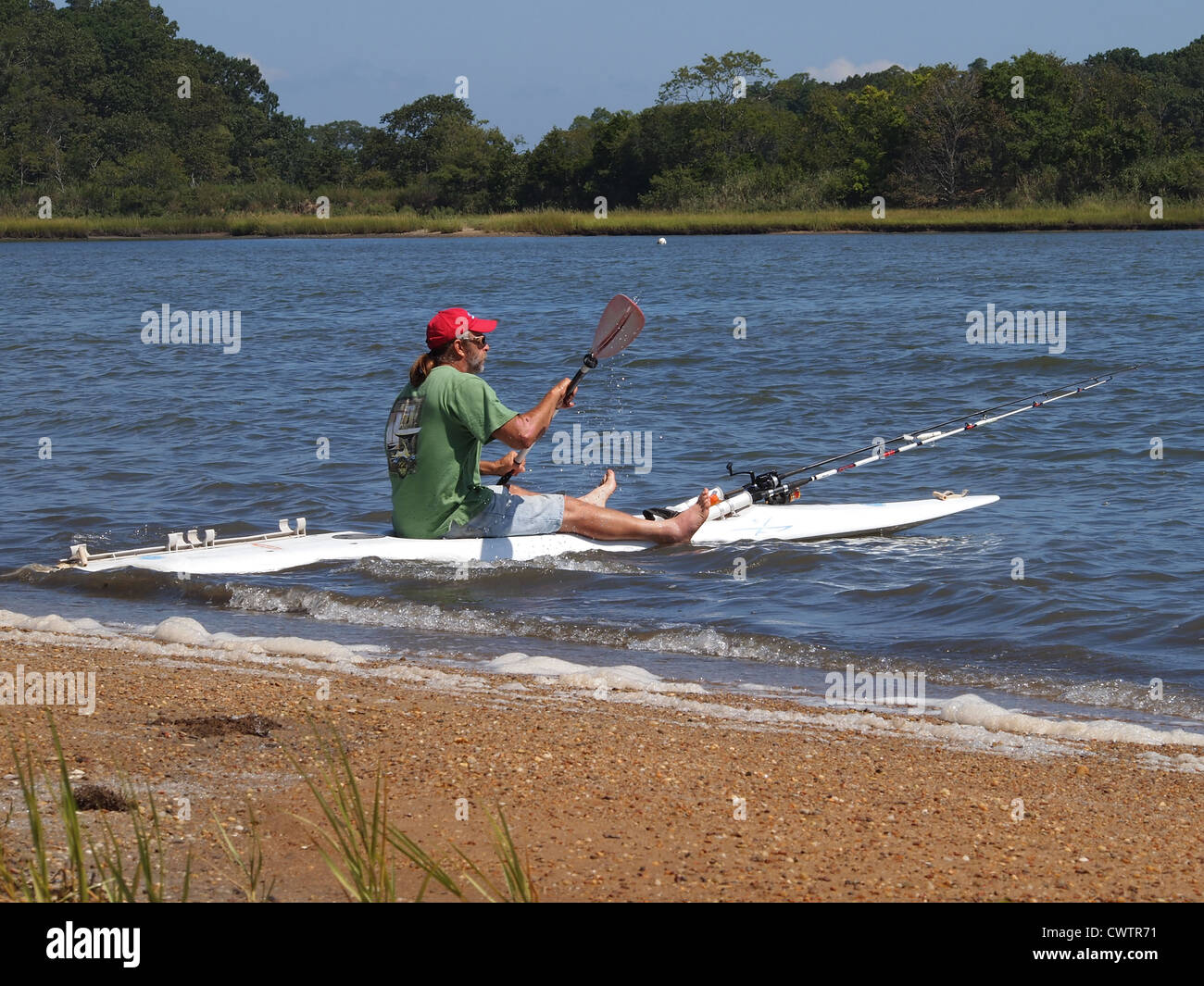 Man kayaking with fishing gear in Long Beach Bay, Orient, Long Island ...
