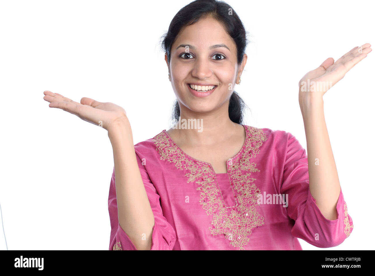 Excited young Indian woman against white background Stock Photo - Alamy