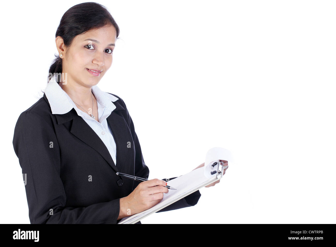Young business woman standing and taking notes against white background ...