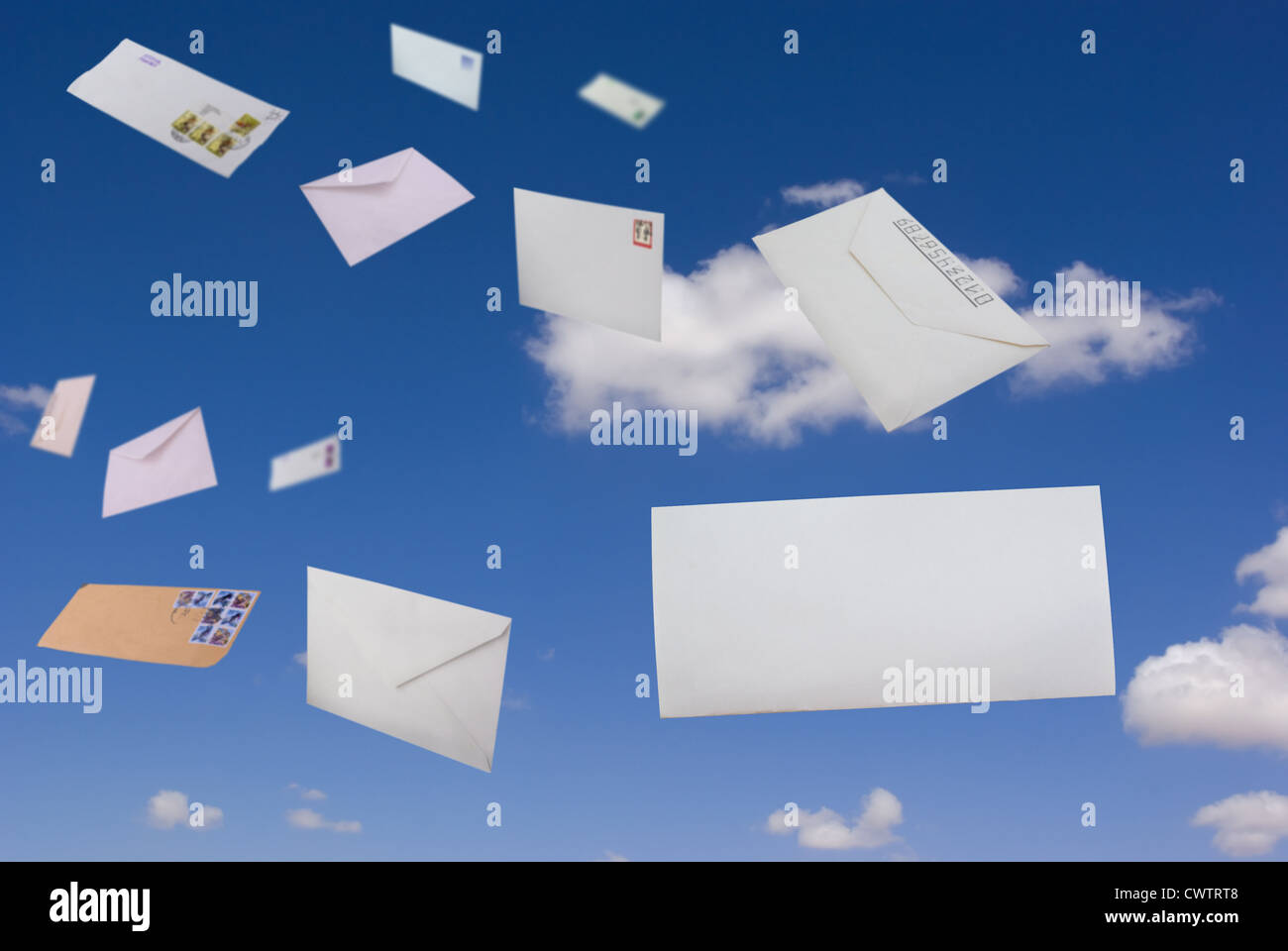Envelopes flying against the blue sky and clouds Stock Photo - Alamy