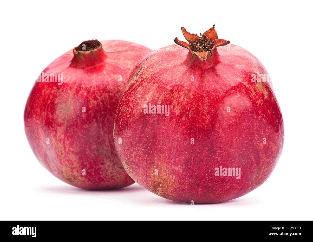 Pomegranate fruit closeup on white background Stock Photo - Alamy