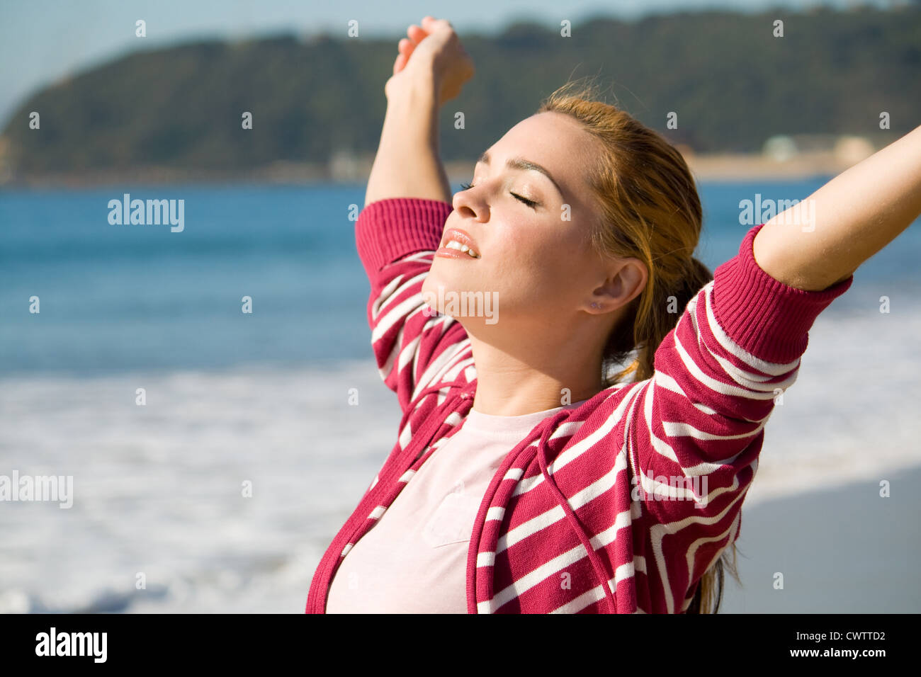 Woman with arms lifted hi-res stock photography and images - Alamy