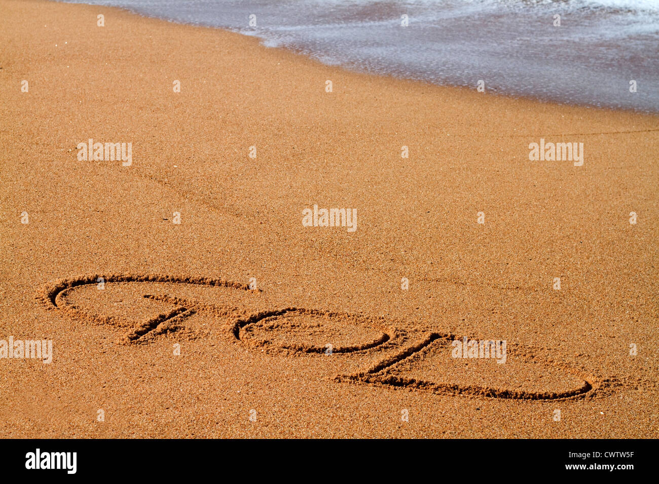 the word God written on beach Stock Photo - Alamy