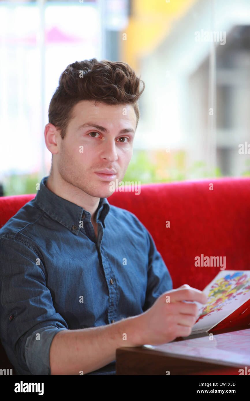 Young handsome man ordering in restaurant Stock Photo - Alamy