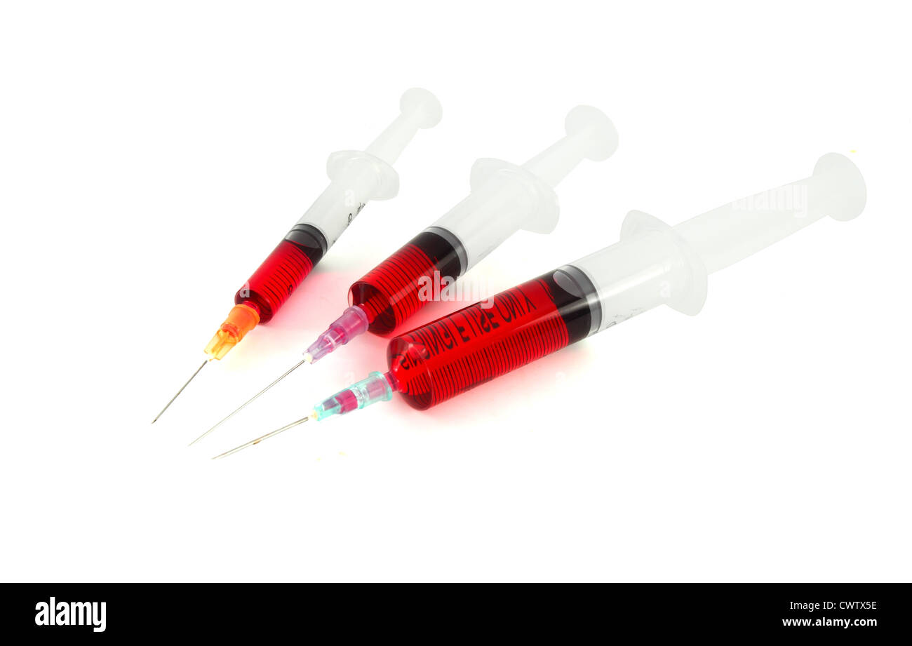Three syringe against white background Stock Photo - Alamy