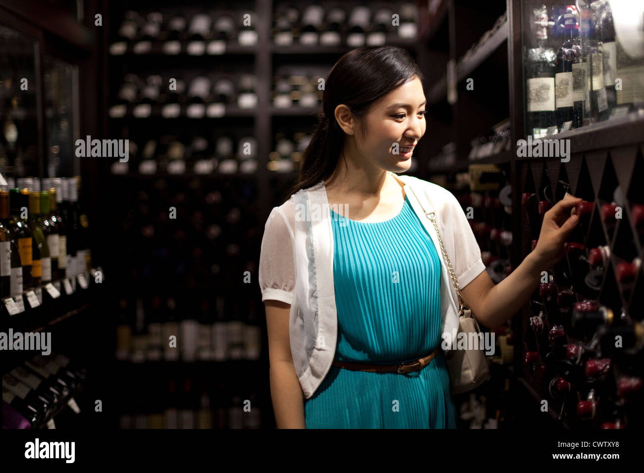 Young woman shopping in cellar Stock Photo - Alamy