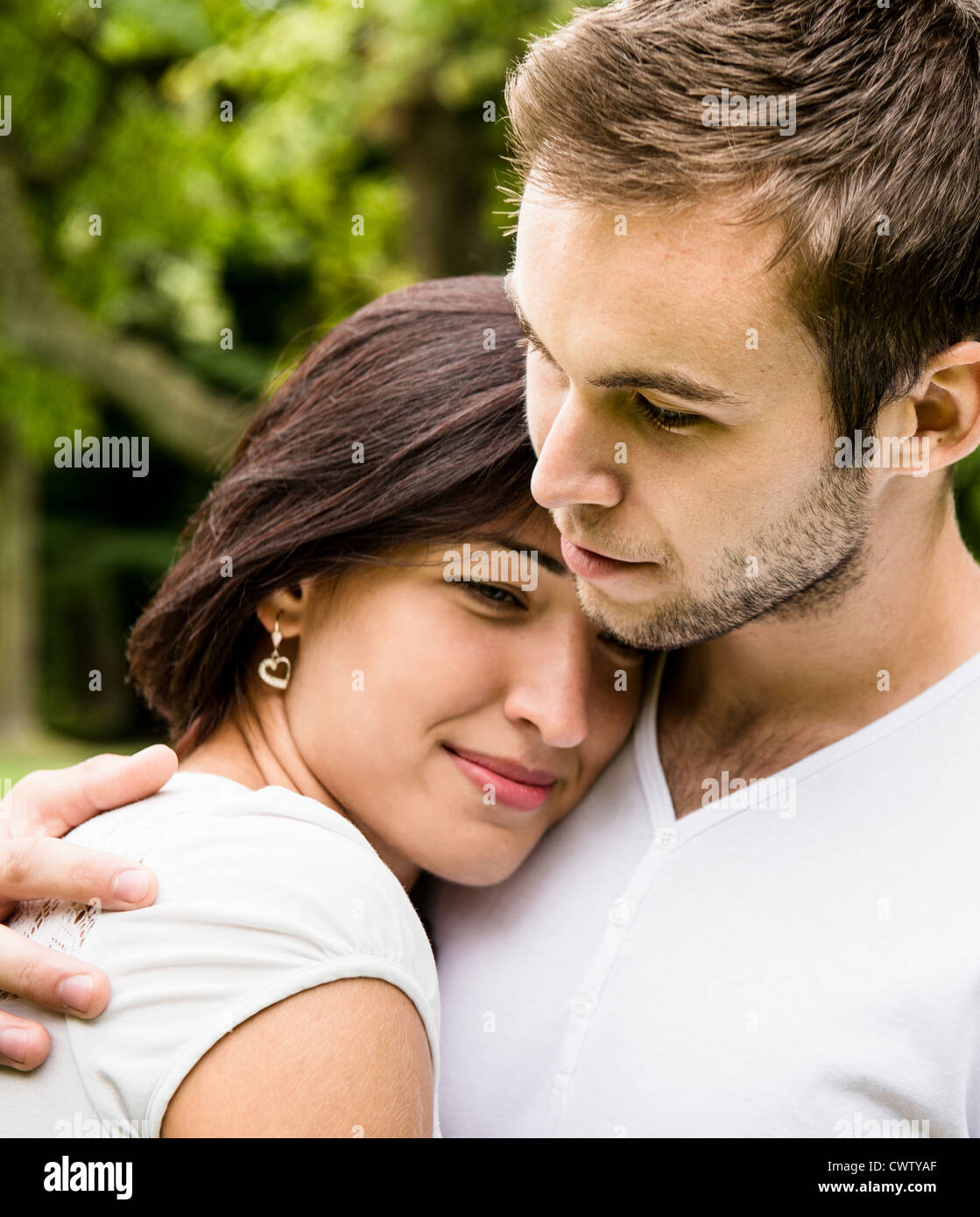 Romantic moments - young couple together, woman's head laid on men's ...